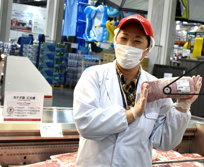 Woman Holding Verified Canadian Pork product